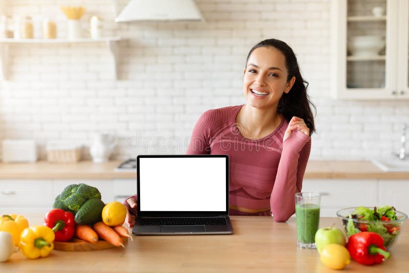 Cheerful Lady Showing Laptop Blank White Screen in Home Kitchen Stock ...