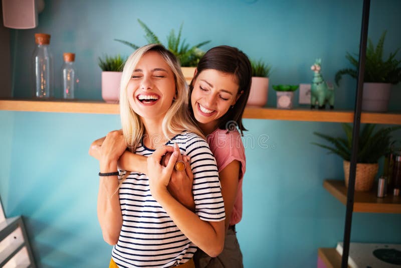 Cheerful Lesbians Embrace Passioantely And Have Fun Together Stock