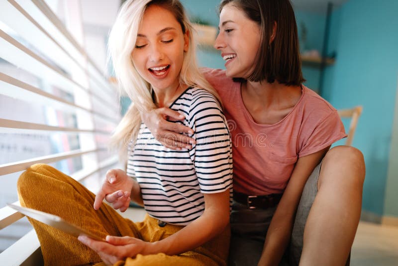 Cheerful Lesbians Embrace Passioantely And Have Fun Together Stock