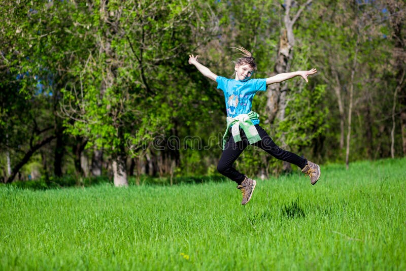 Cheerful Little Girl Jump on the Grass Stock Image - Image of lifestyle ...