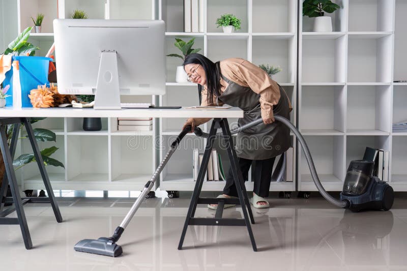 Cheerful Maid Vacuuming in Bright and Modern Office Setting Stock Photo ...
