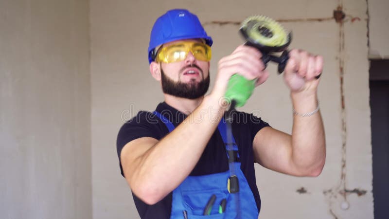 Cheerful Male Builder is Dancing at a Construction Site. Portrait of a ...