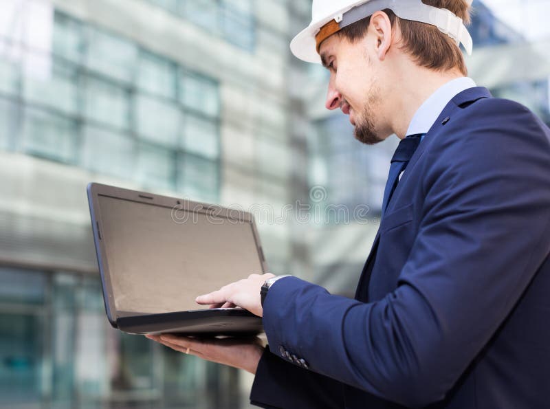 Male Engineer Talking about Work at the Laptop Stock Photo - Image of ...