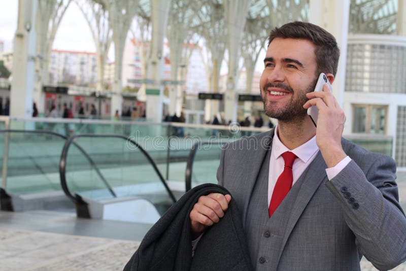 Cheerful Male Making a Call from a Terminal Stock Image - Image of ...