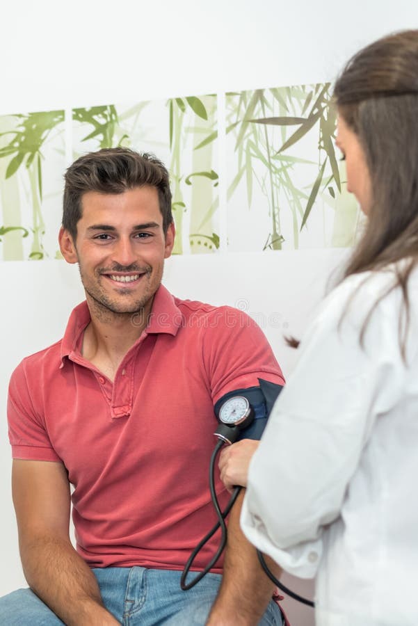 Cheerful Male Patient and Doctor Stock Photo - Image of pressure, copy ...