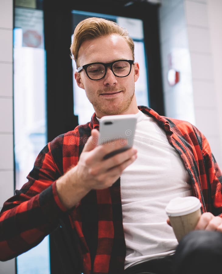 Cheerful Man Browsing Mobile Phone at Workspace Stock Image - Image of ...