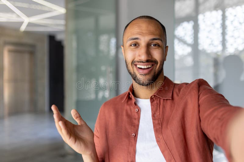 Smiling Man Taking a Selfie during a Video Call with His Smartphone in ...
