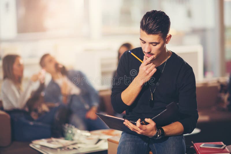 Cheerful man making notes stock image. Image of person - 82793545