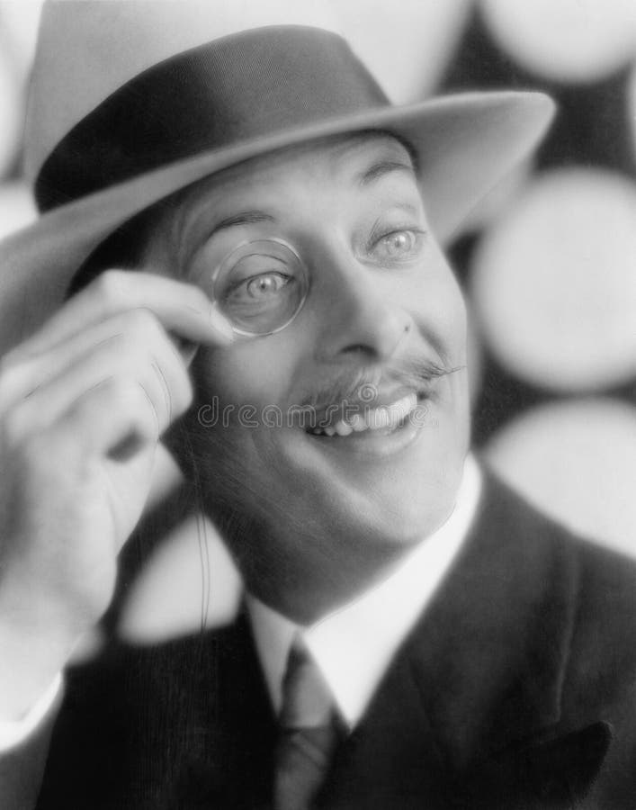 Cheerful man with monocle stock image. Image of holding - 52012647