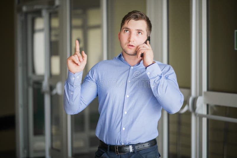 Cheerful Man in Office Answering the Phone Stock Photo - Image of ...