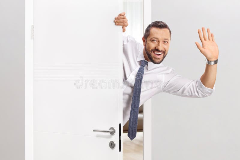 Cheerful Man Opening a Door Stock Image - Image of peek, wave: 337834001