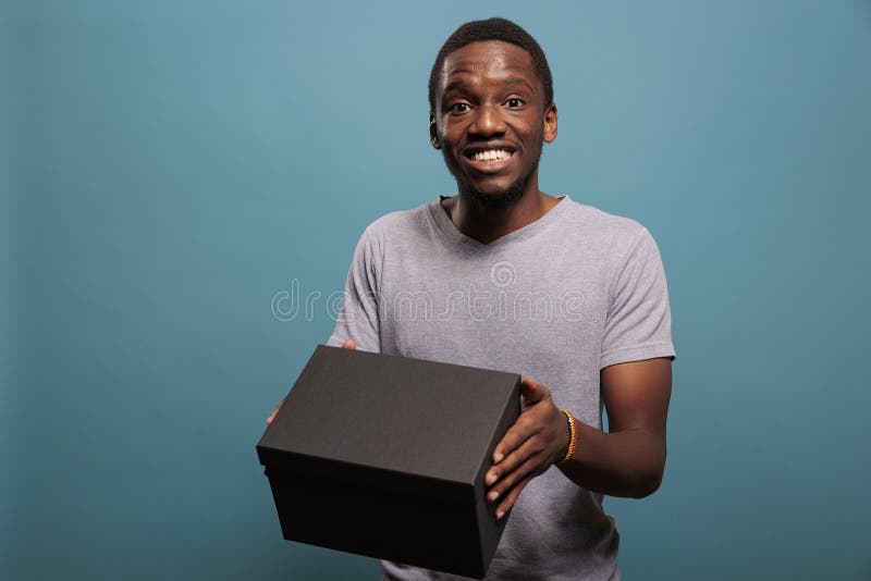 125 Black Guy Opening Box Photos - Free & Royalty-Free Stock Photos ...