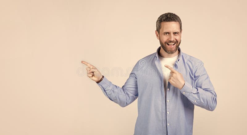 Cheerful Man Pointing and Offer Advertisement in Studio. Photo of Man ...