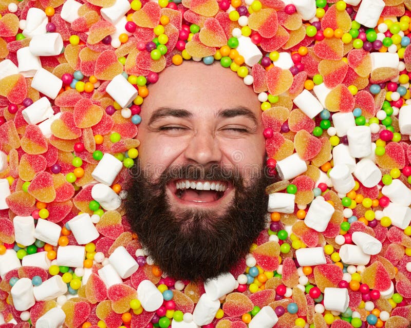 Cheerful Man Posing in Candies Stock Photo - Image of dessert, concept ...