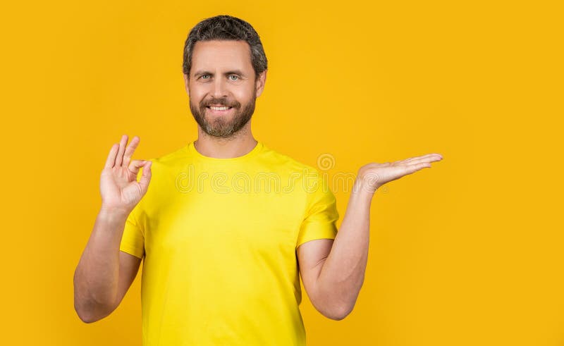 Cheerful Man Presenting Advertisement in Studio, Ok. Photo of Man ...
