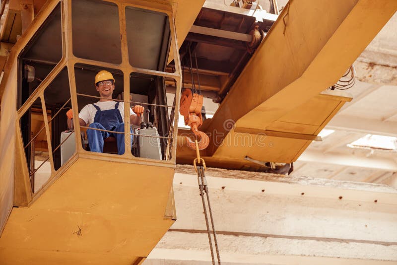 Cheerful Man Sitting in Operator Cabin of Overhead Crane Stock Photo ...