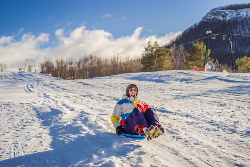 Cheerful Man Sledding Down a Snowy Slope in Full Speed BANNER, LONG ...