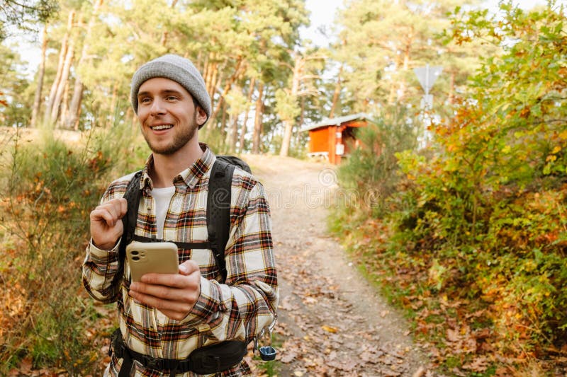 Cheerful Man Tourist Using Mobile Phone during Hiking in Forest Stock ...