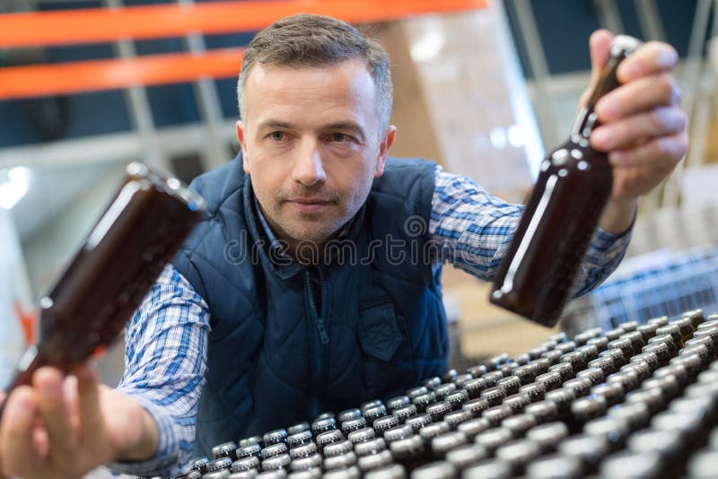 Men Working at Brewery or Beer Plant Stock Photo - Image of takingnotes ...