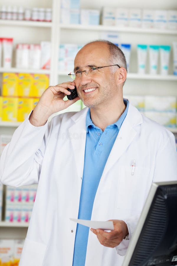 Cheerful Mature Pharmacist on the Phone Stock Photo - Image of chemist ...