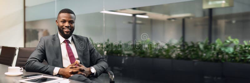 Cheerful Black Guy CEO Sitting at Conference Hall Stock Image - Image ...