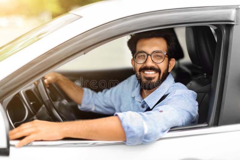 Cheerful Millennial Indian Guy with Glasses Driving White Auto Stock ...