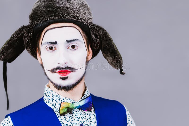 Cheerful Mime Posing and Grimacing in the Studio Stock Photo - Image of ...