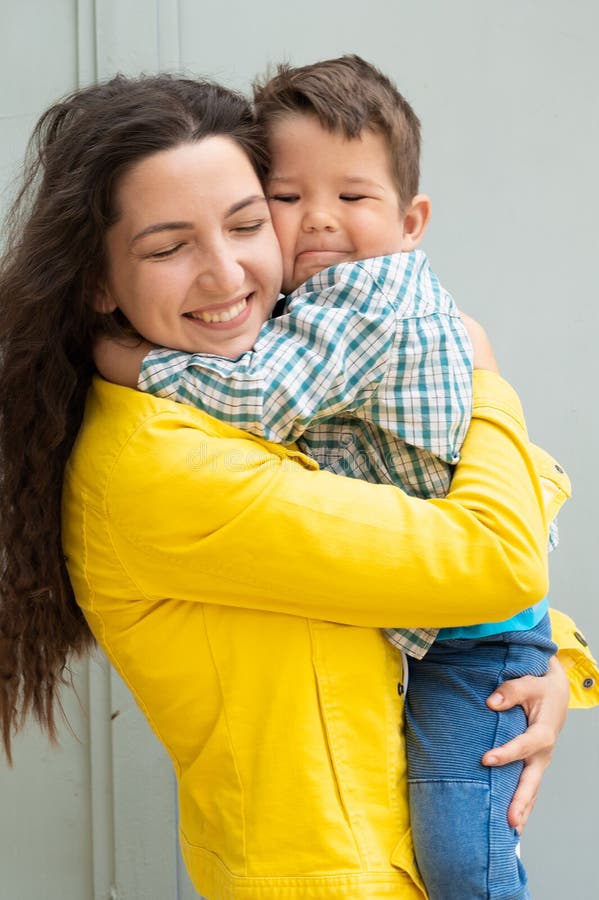 Cheerful Mother Hugs the Child Stock Photo - Image of happiness, parent ...