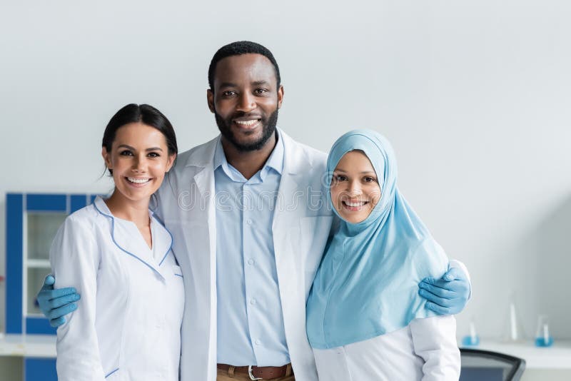 Cheerful Multicultural Scientists Hugging in Laboratory. Stock Photo ...