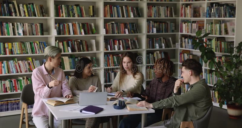 Cheerful Multiethnic High School Students Doing Homework Together Stock ...