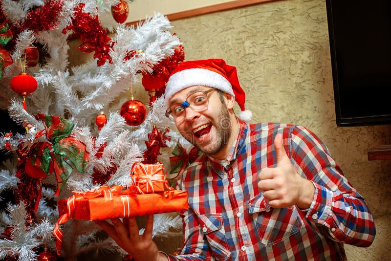 Cheerful Nerd Gets Christmas Presents Stock Photo - Image of people ...