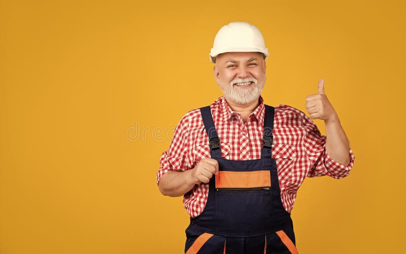 Cheerful Old Aged Man Builder in Helmet on Yellow Background Stock ...