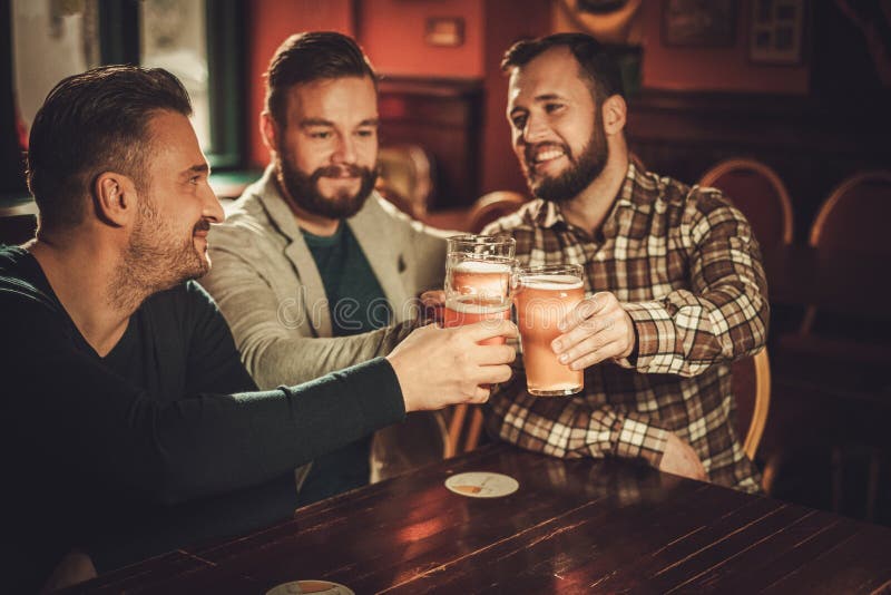 Cheerful Old Friends Having Fun and Drinking Draft Beer in Pub. Stock ...