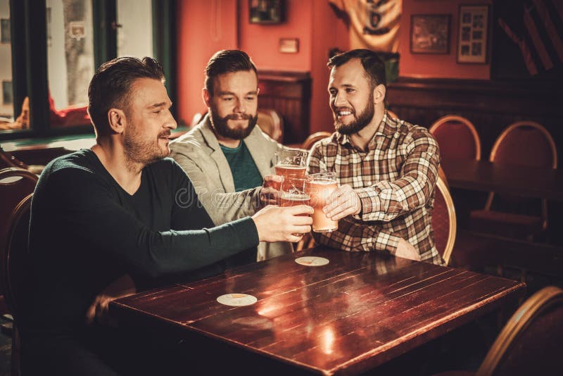 Cheerful Old Friends Having Fun and Drinking Draft Beer in Pub. Stock ...