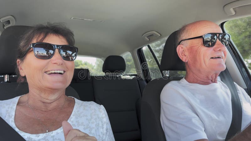 Cheerful Old Man And Happy Woman Dancing And Singing Together While