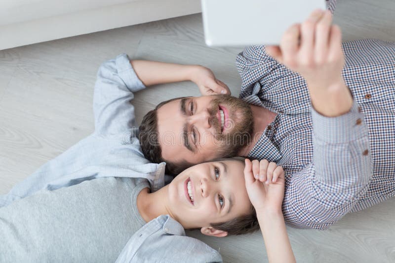 Cheerful Parent and Child Using Modern Technology Stock Image - Image ...