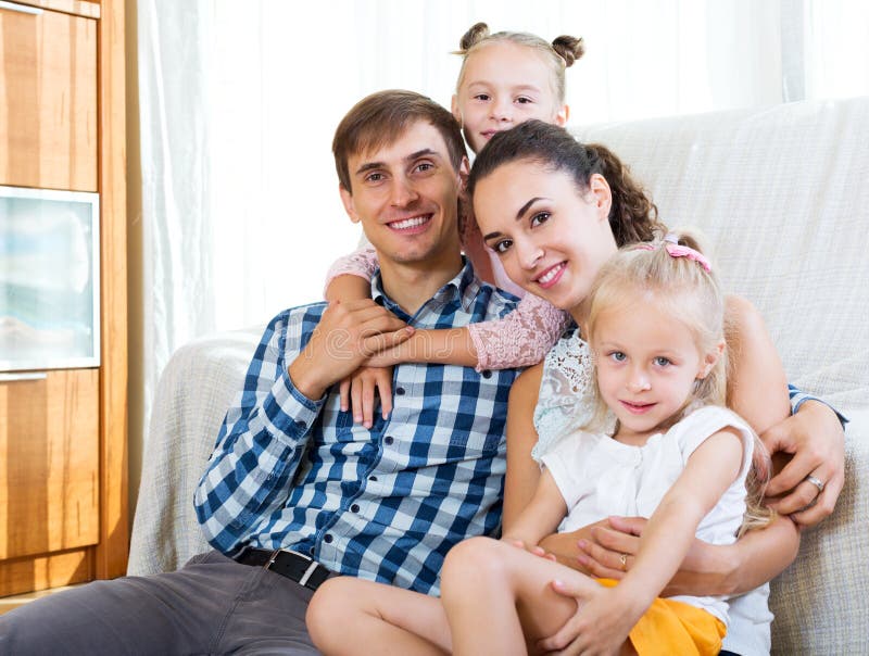 Cheerful Parents with Two Daughters Stock Image - Image of home ...