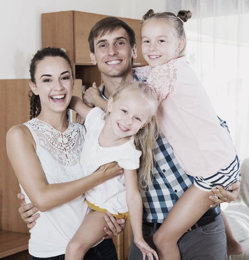Cheerful Parents with Two Daughters Stock Photo - Image of european ...