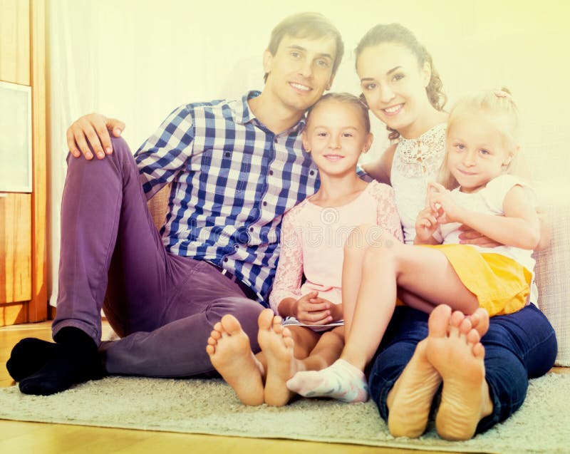 Cheerful Parents with Two Daughters Stock Photo - Image of parenting ...