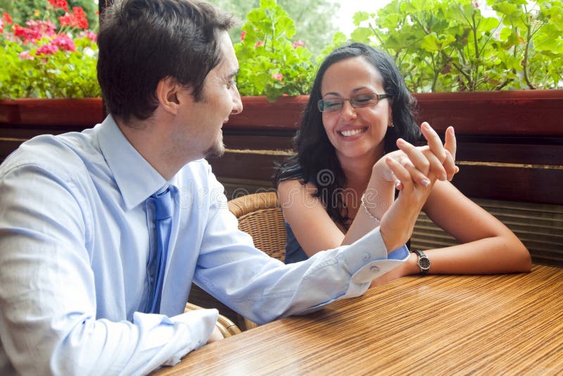 Cheerful Pretty Couple at Restaurant Table Stock Photo - Image of ...