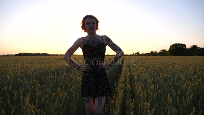 Cheerful Punk Girl in Short Black Dress Fooling Around while Walks ... Cheerful Punk Girl in Short Black Dress Fooling Around while Walks ...