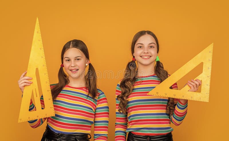 Cheerful School Children Hold Math Tool of Triangle Stock Photo - Image ...