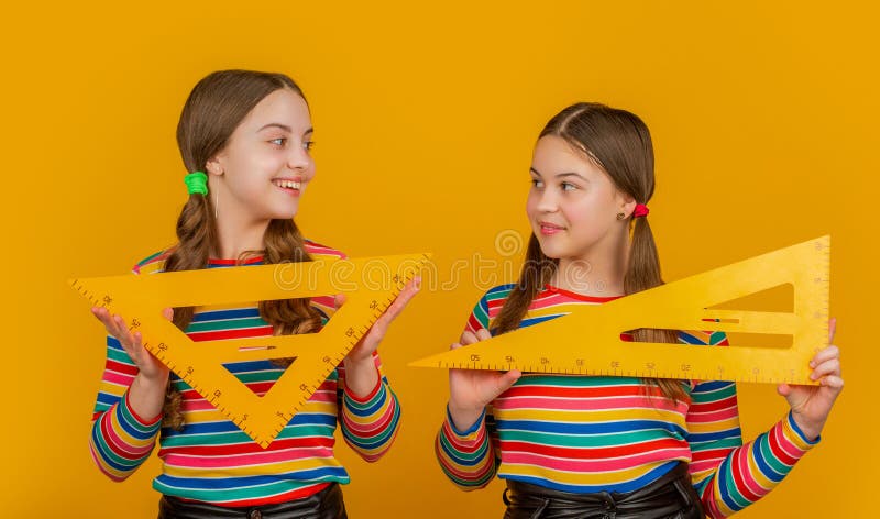 Cheerful School Kids Hold Math Tool of Triangle Stock Photo - Image of ...