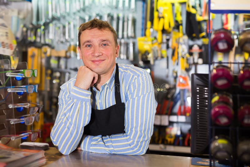Cheerful Seller Man in Store is Trading Tools Stock Photo - Image of ...