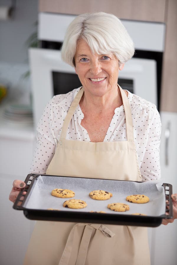 Cheerful Senior Lady Baking Pastry with Enjoyment Stock Image - Image ...