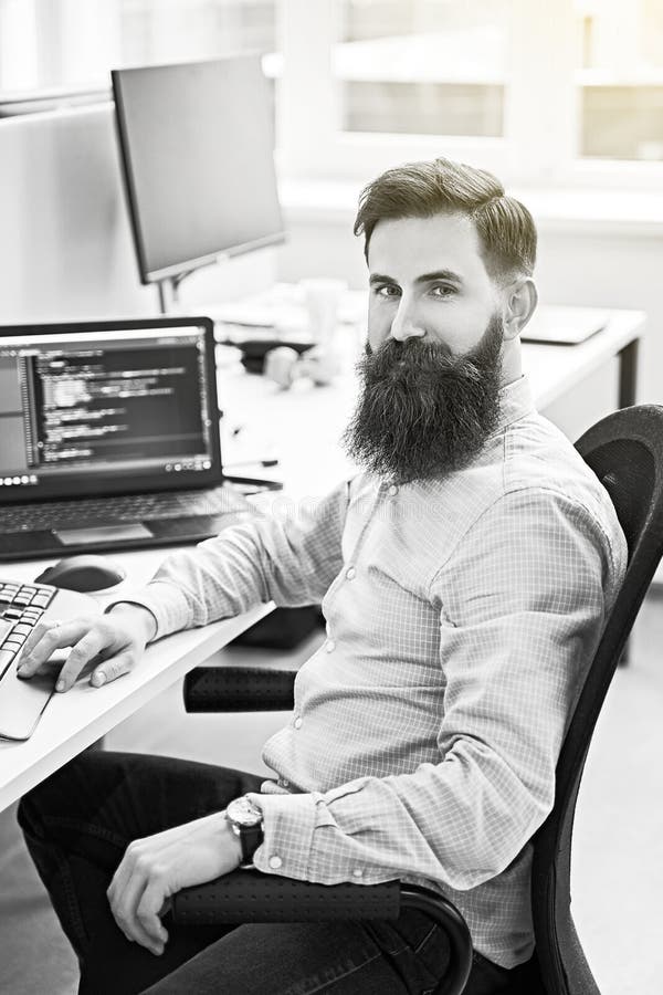 Cheerful Senior Programmer Developer Working In IT Office, Sitting At Desk And Coding, Working ...