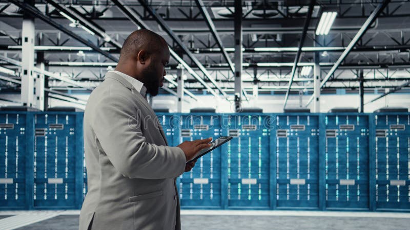 Cheerful Server Room Engineer Troubleshooting Backend Operations Using Tablet Stock Photo ...