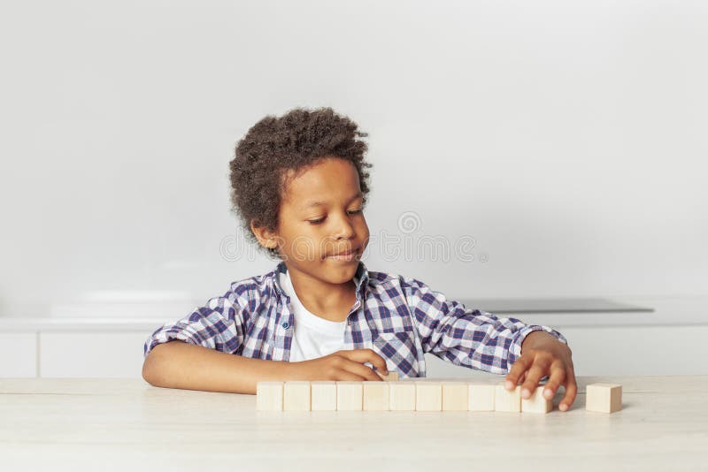 Cheerful Small Kid Boy with Empty Wooden Cubes at Home Stock Photo ...