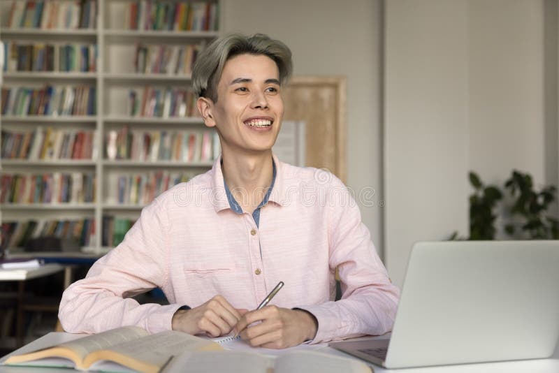 Cheerful Smart Asian Student Guy Working on Article Stock Photo - Image ...