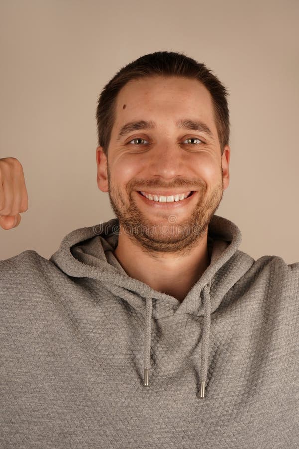 The Smile Makes the Gesture Feel Friendly and Motivating. with a ...